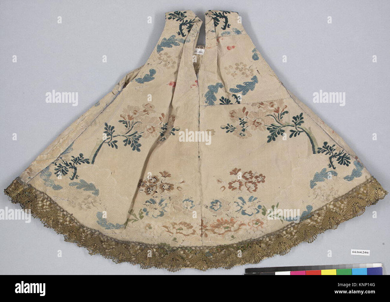 This dress for a statuette represents miniature garment design, textile ...