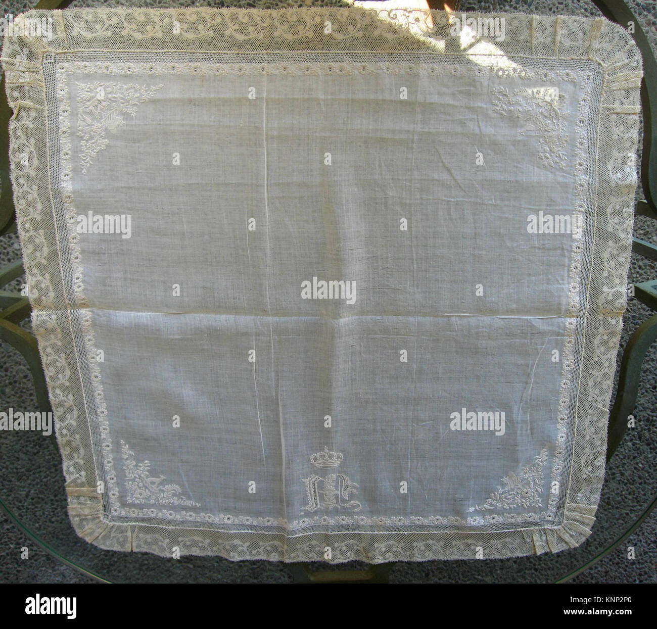 A handkerchief, square textile for hygiene or decorative use, made from ...