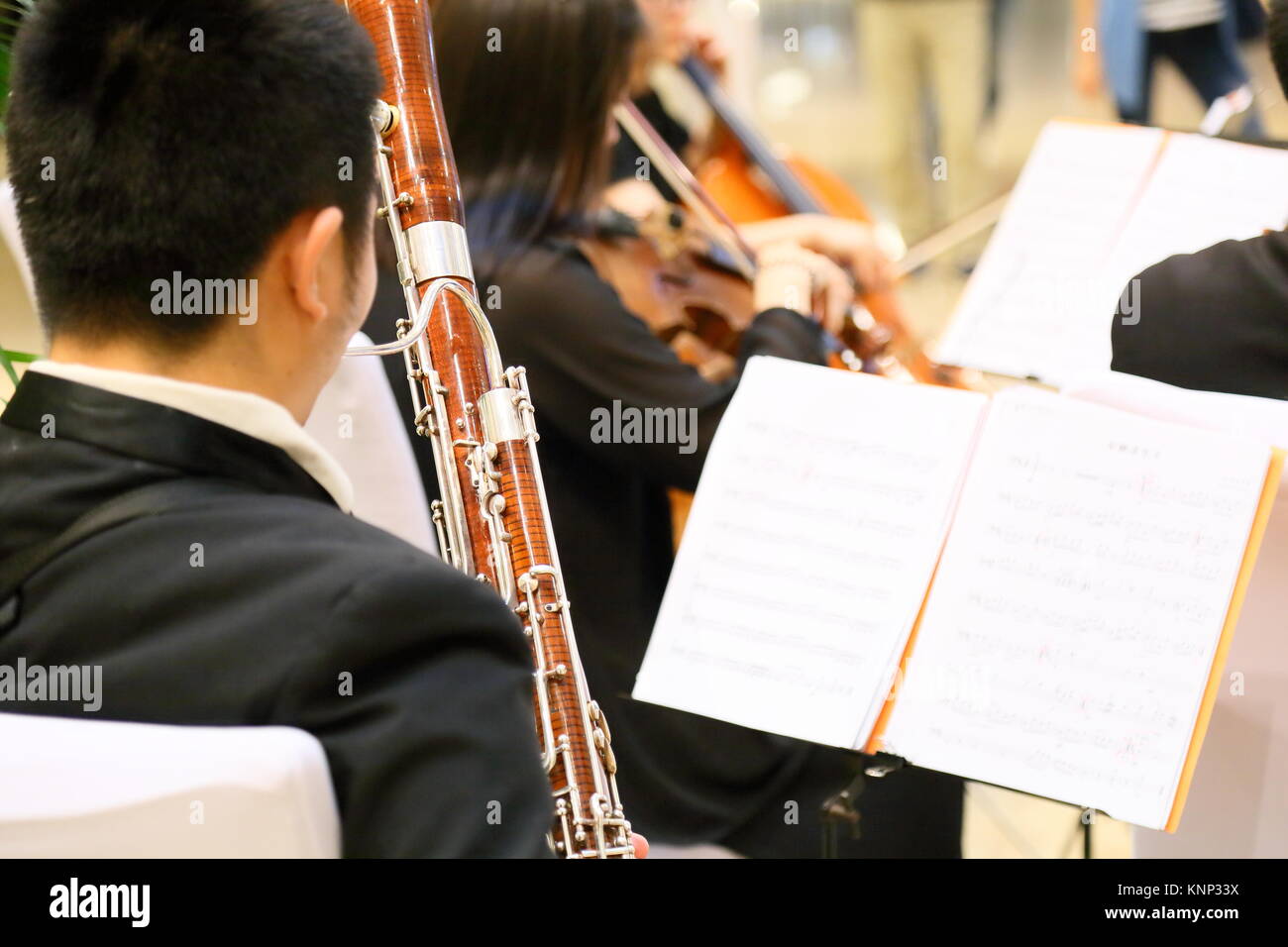 Symphony performance in room Stock Photo - Alamy