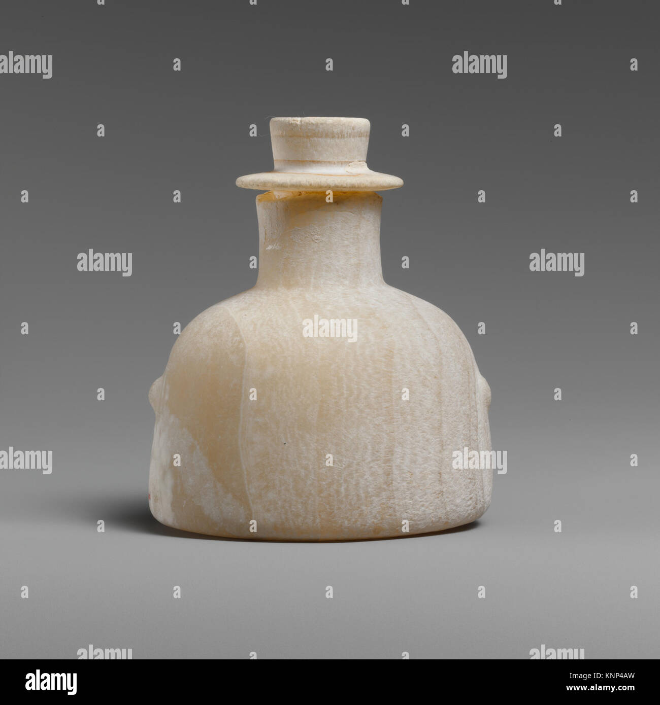 Alabaster flask with stopper, designed to store liquids, demonstrating ...