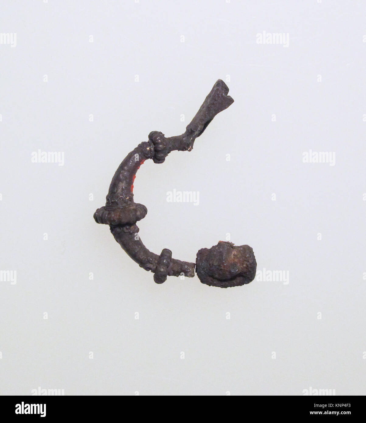This fibula is an ancient brooch or pin used to fasten garments ...