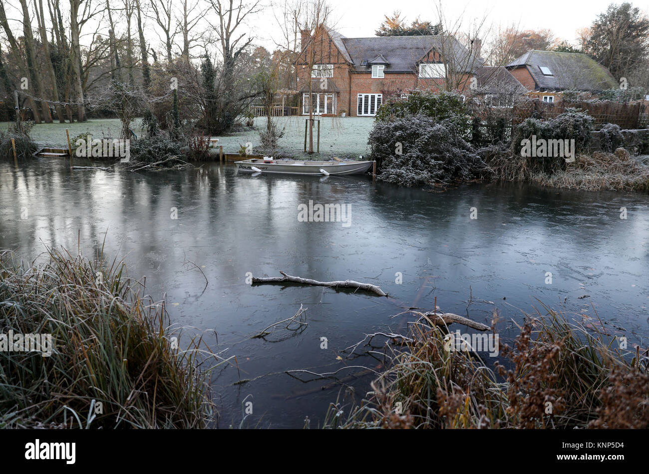 A layer of ice covers the Basingstoke Canal near to Dogmersfield in ...