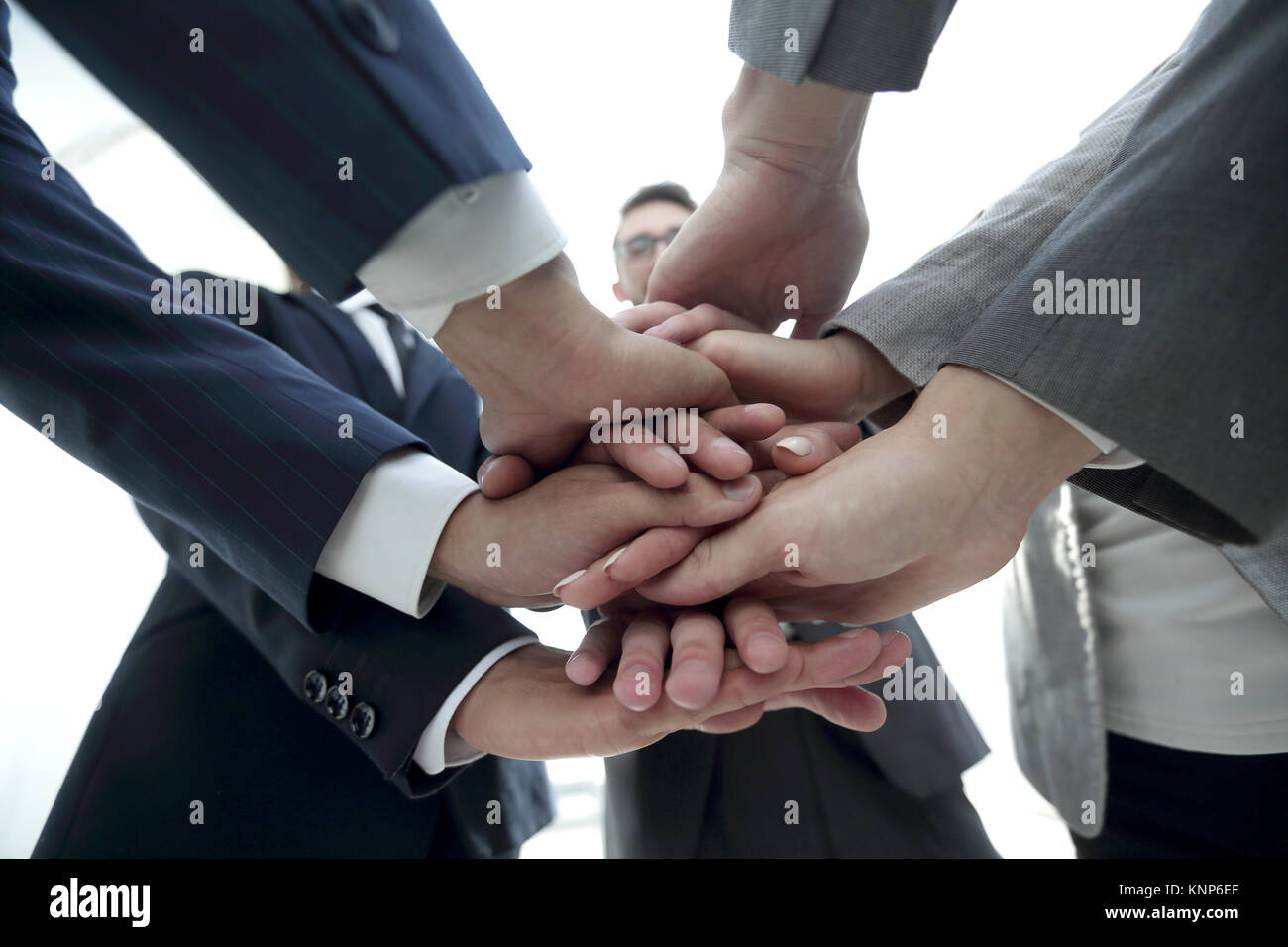 business people folding their hands together Stock Photo - Alamy