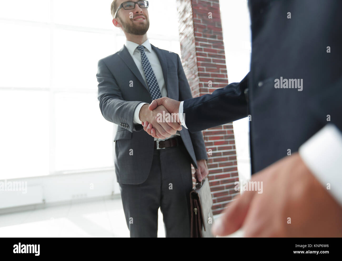 business leader shaking hands with partner Stock Photo - Alamy