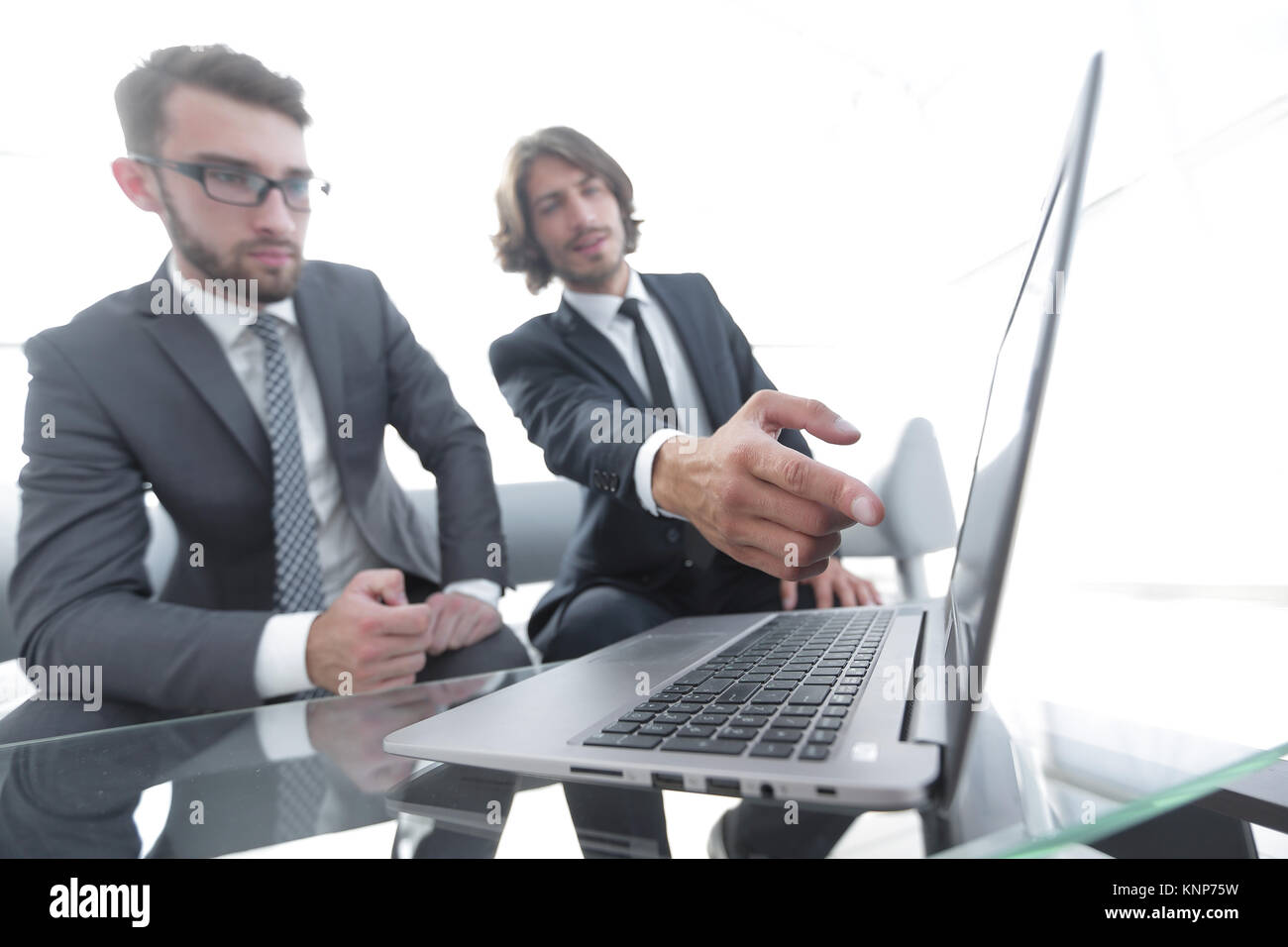Two businessmen working on a project together Stock Photo - Alamy
