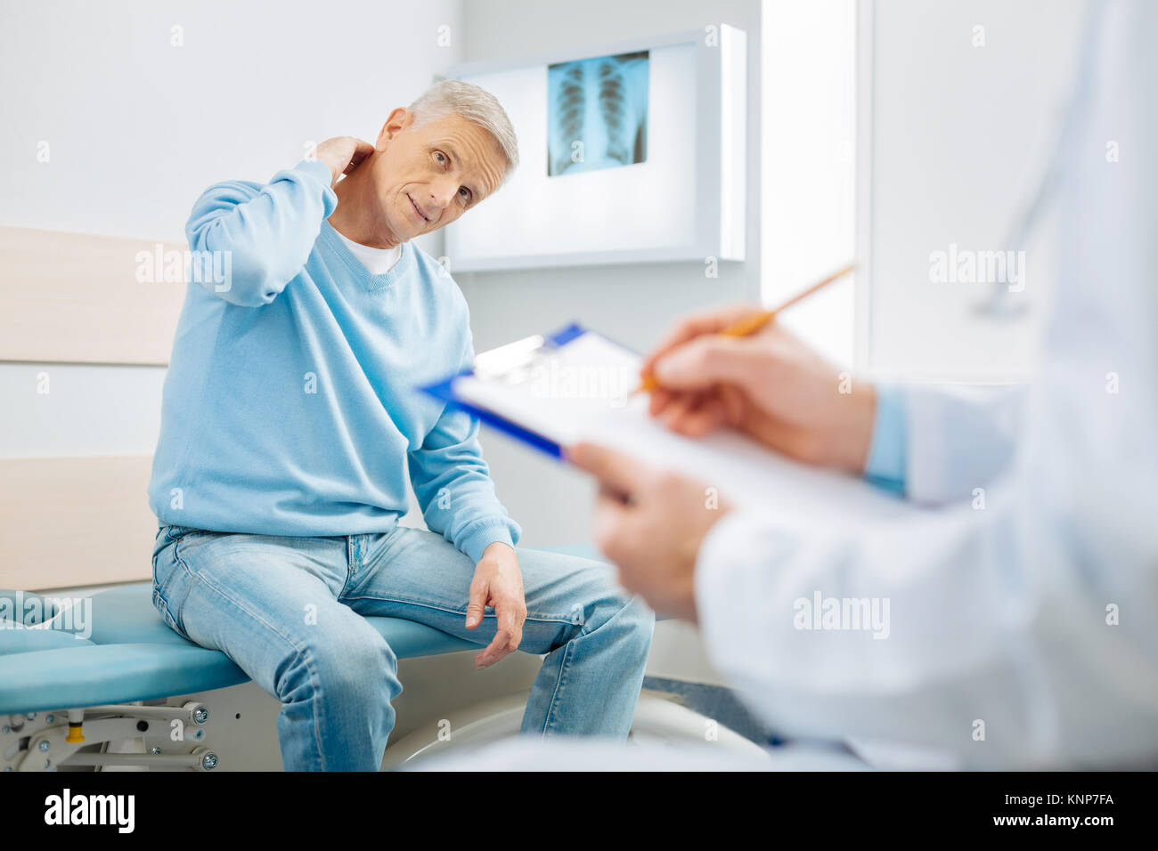 Nice senior man looking at his therapist Stock Photo - Alamy