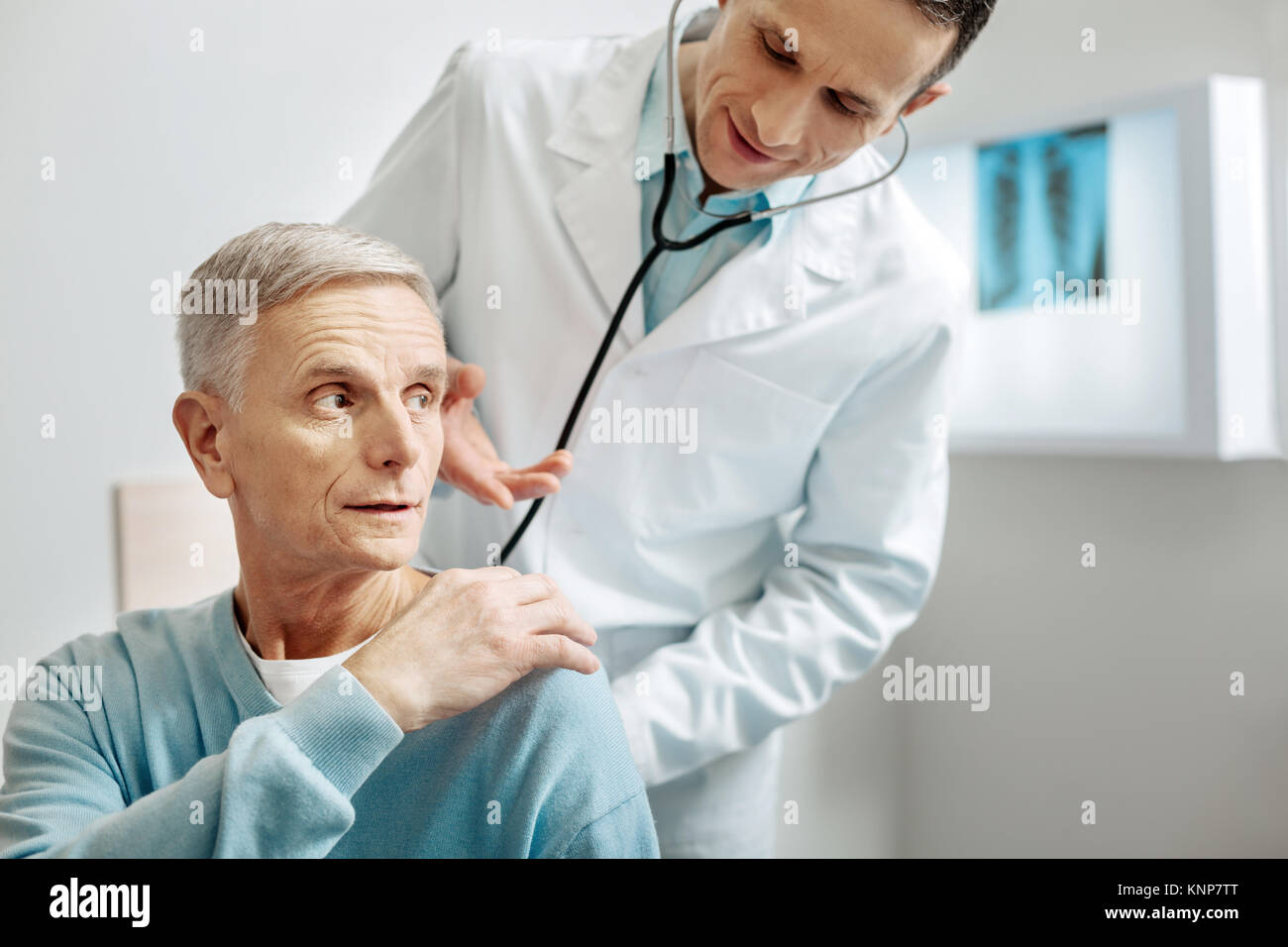 Nice aged man turning to the doctor Stock Photo - Alamy