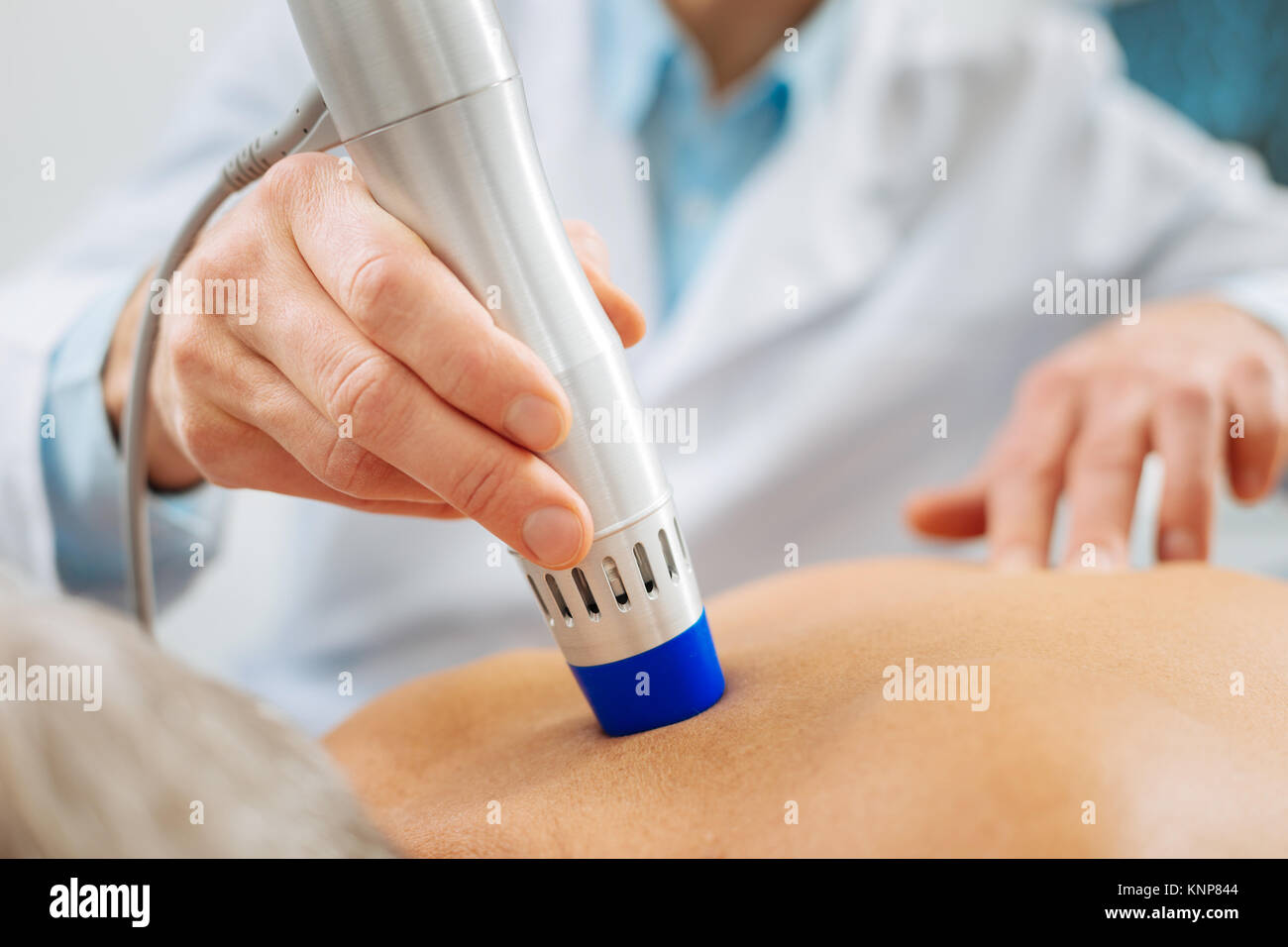 Medical therapy. Close up of a special device being used by a nice ...