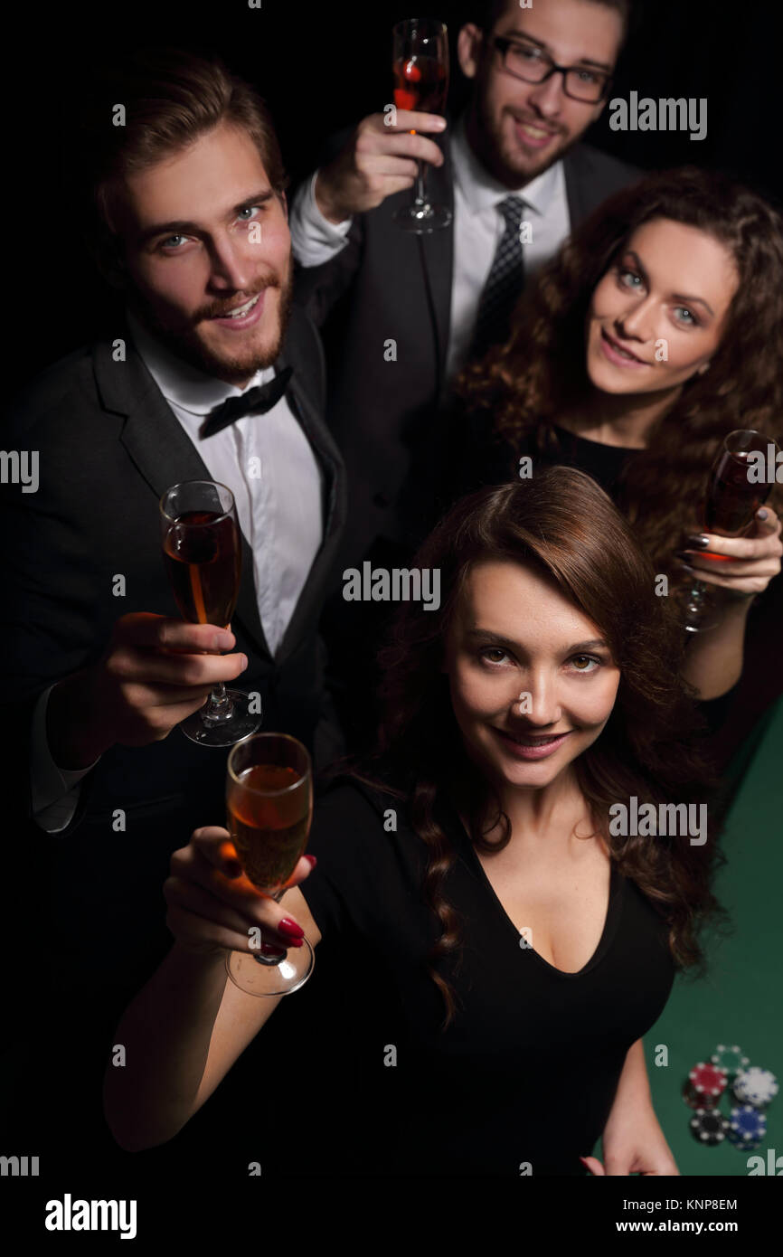 group of friends celebrating win at the casino Stock Photo - Alamy