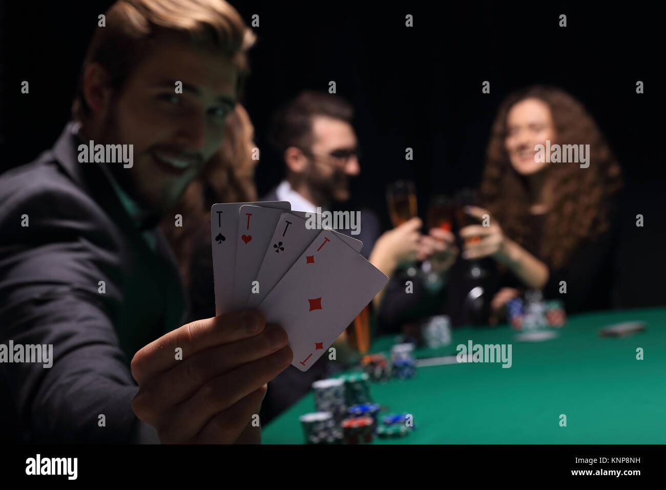 Gambler man in casino sitting at table with cards and poker chips Stock ...