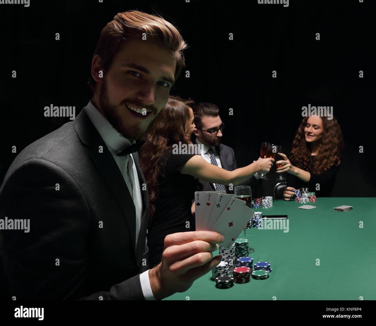 Lucky man with the winning combination of cards Stock Photo - Alamy