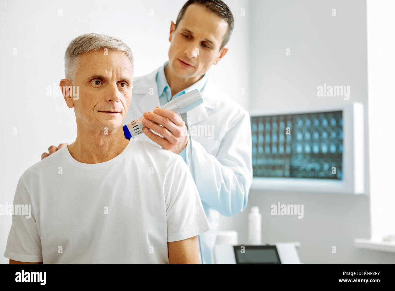 Serious nice patient being examined Stock Photo - Alamy