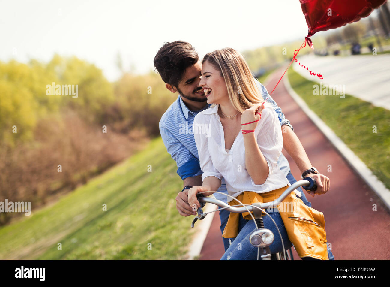Romantic couple with bicycle hi-res stock photography and images - Alamy