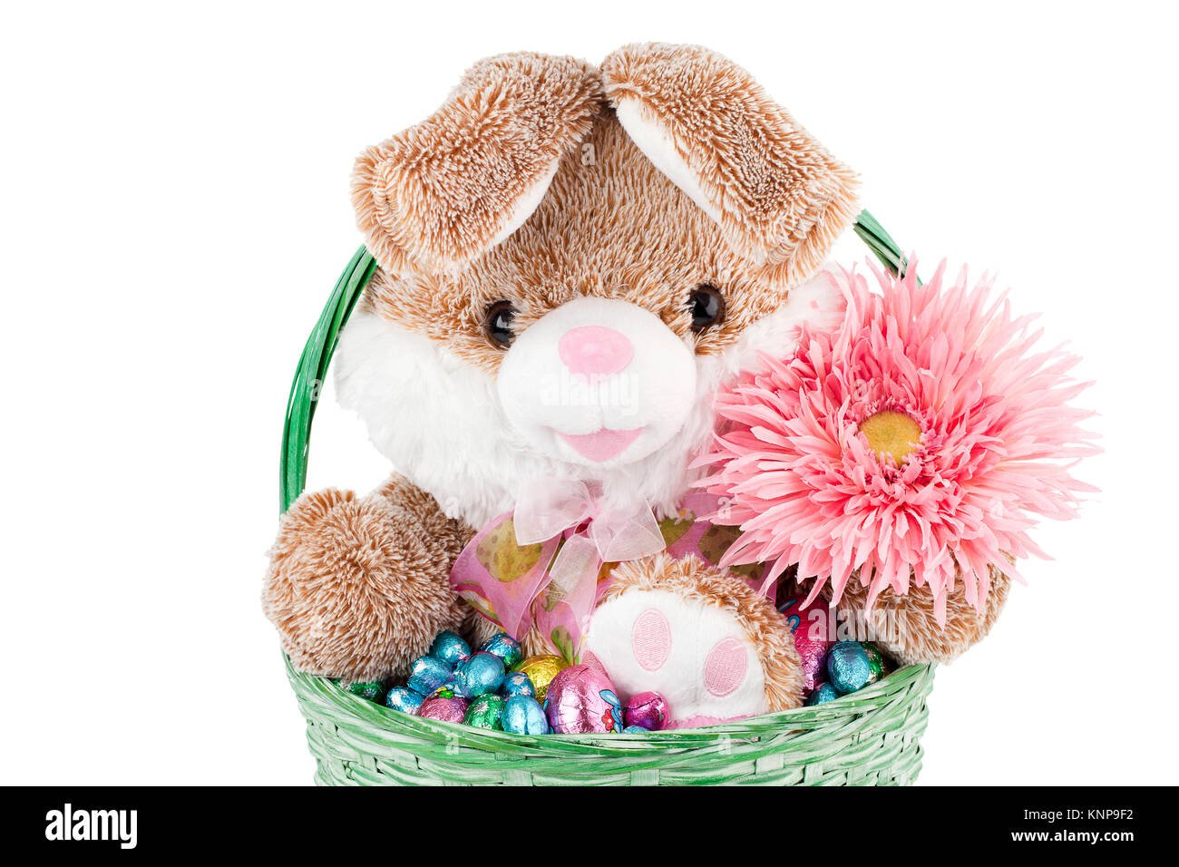 bunny and chocolates inside a basket Stock Photo - Alamy
