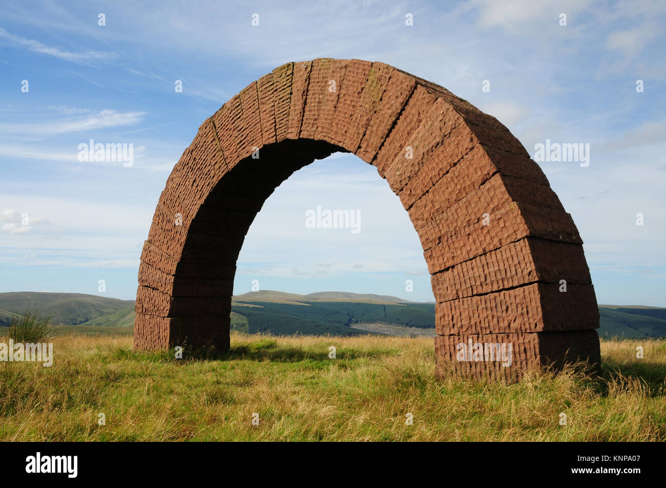 Free standing arch of red sandstone created by Andy Goldsworthy. One of ...