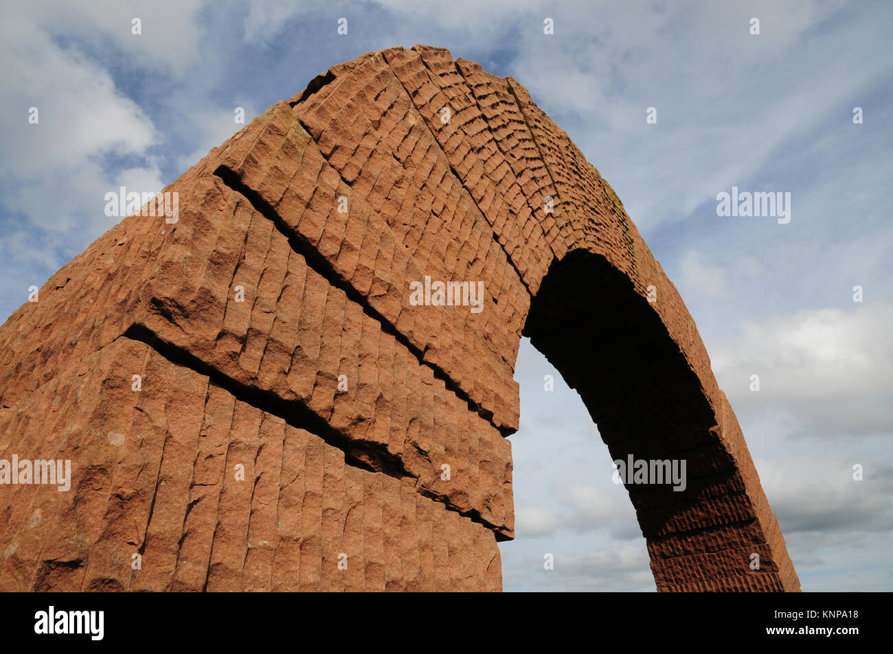 Free standing arch of red sandstone created by Andy Goldsworthy. One of ...