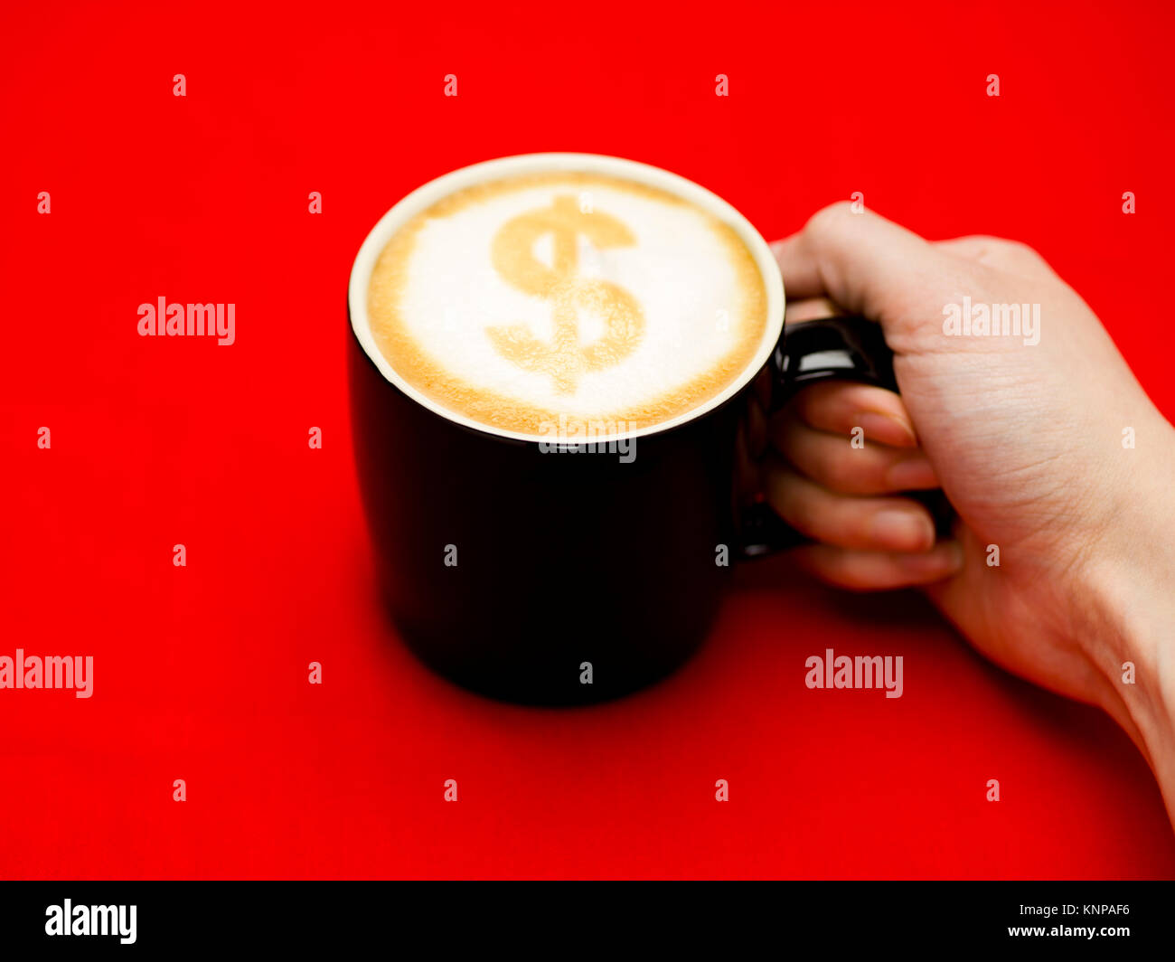 hand grabbing coffee cup with dollar sign Stock Photo - Alamy
