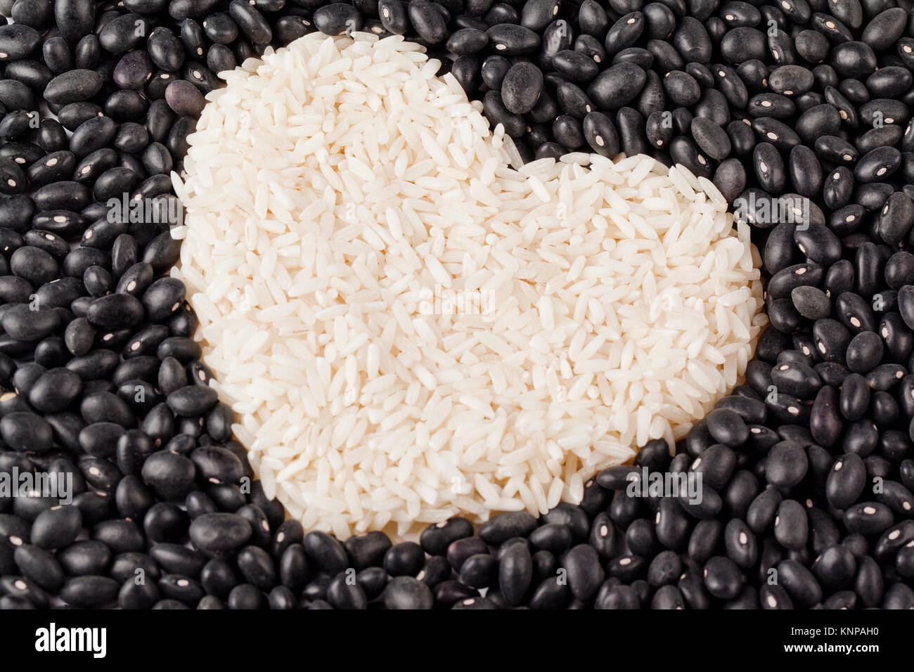heart shape rice grains isolated on the dark beans Stock Photo - Alamy