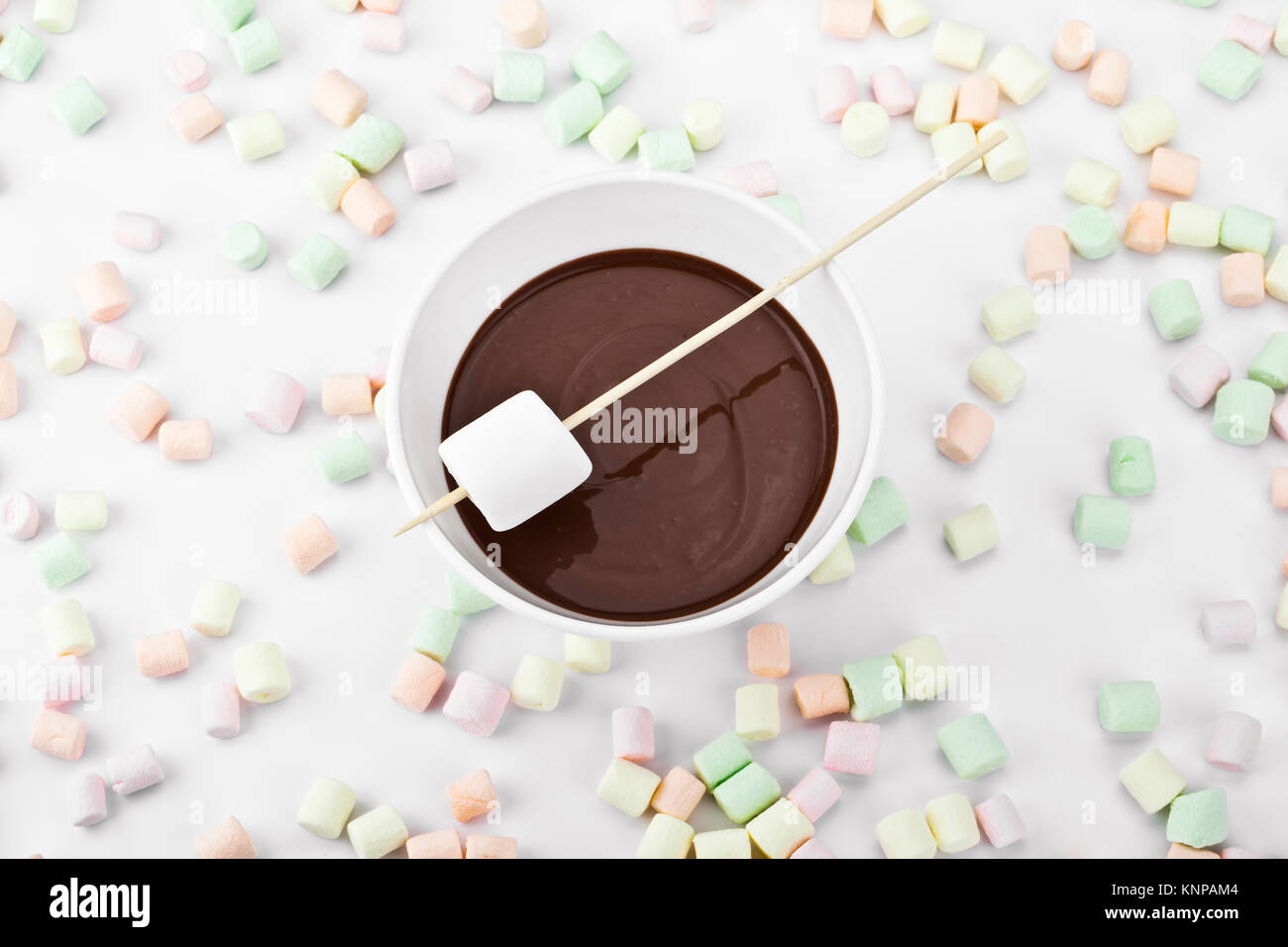 marshmallow in a stick and melted chocolate Stock Photo - Alamy