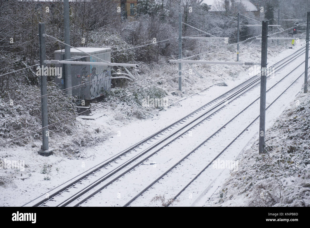 Snow covered train tracks causes travel disruption Stock Photo - Alamy
