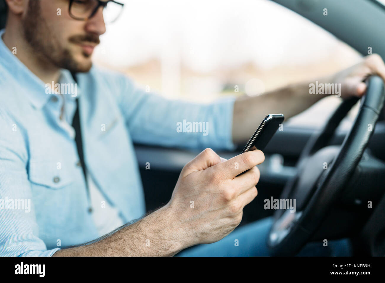 Using mobile phone ignoring hi-res stock photography and images - Alamy