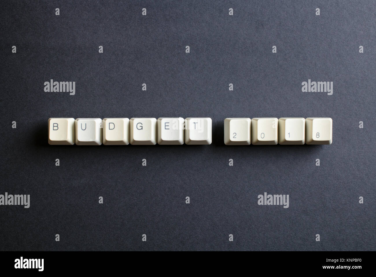 Budget 2018 new year. Flat lay view from above on the table with computer keyboard keys buttons ...