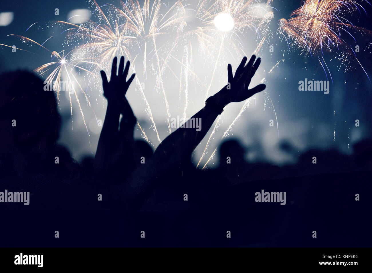 New Year's Eve. Cheering crowd and fireworks Stock Photo - Alamy