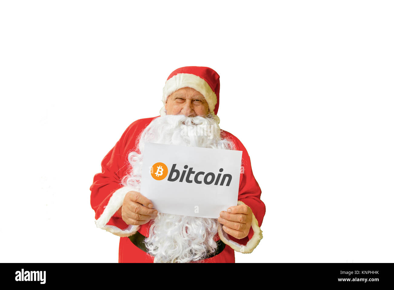 Santa Claus showing signboard with bitcoin public domain logo on white ...
