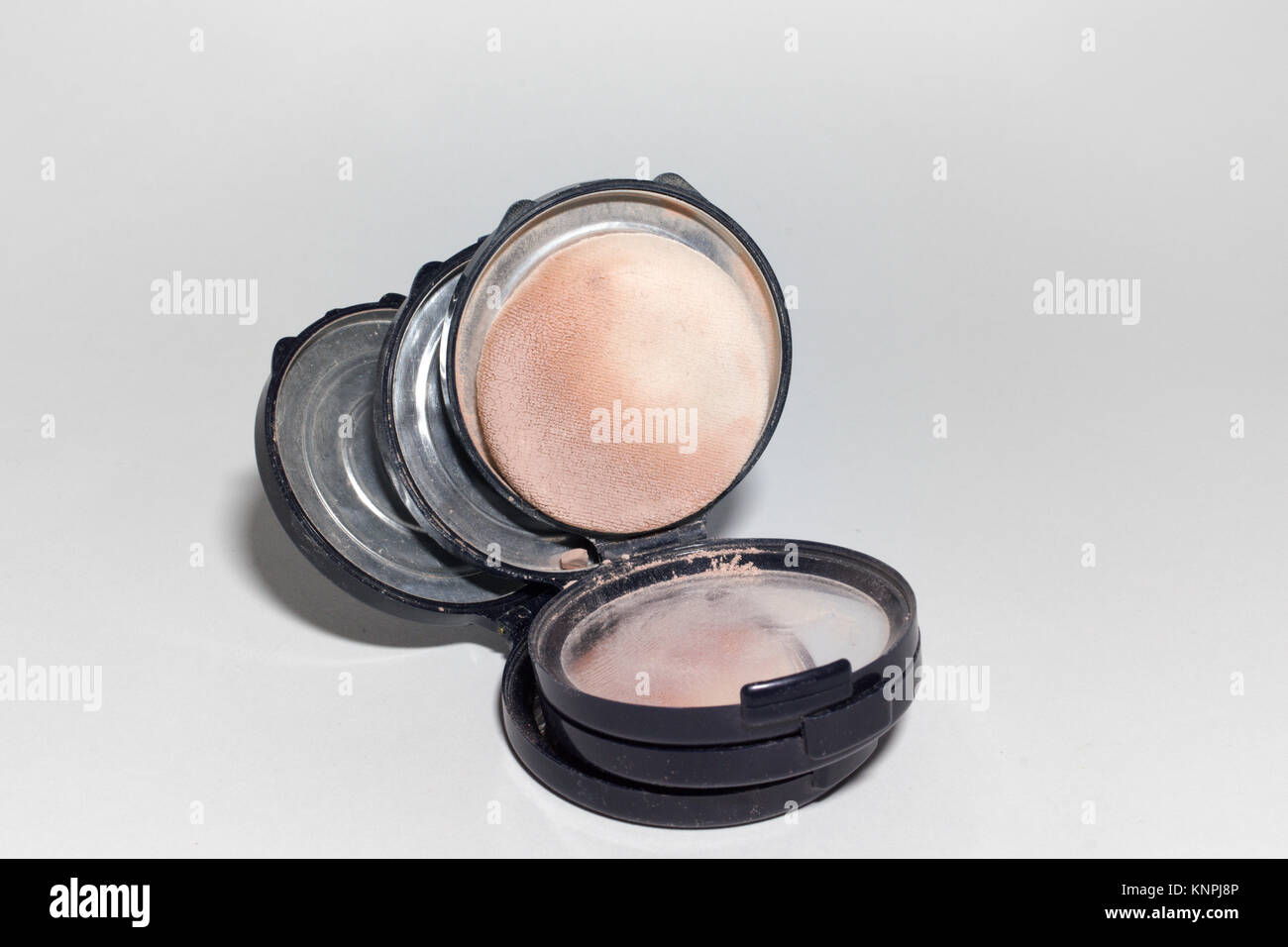 empty powder boxes, lying on each other and used powderpuff Stock Photo ...