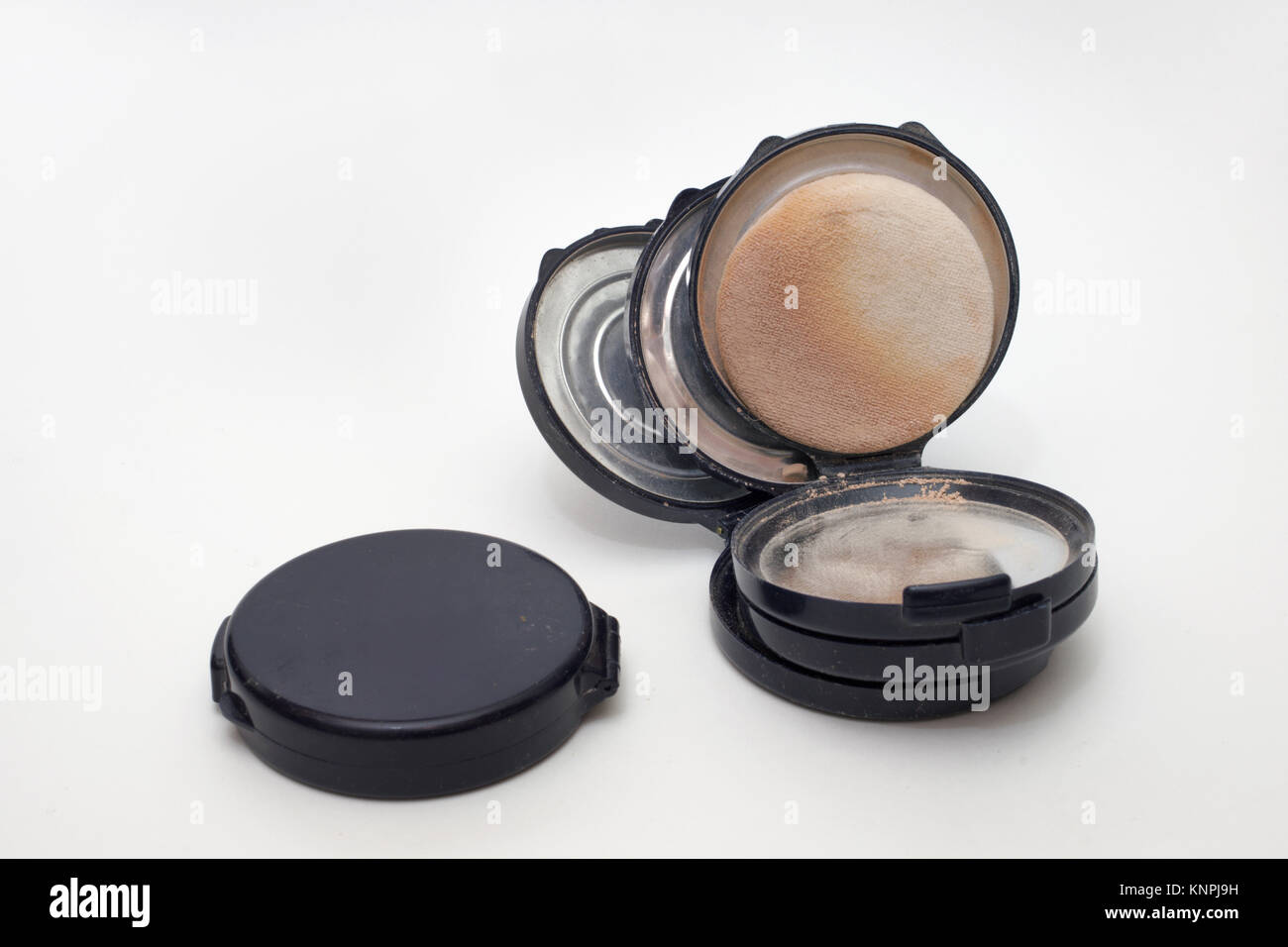 empty powder boxes, closed black compact, dirty powder puff Stock Photo ...
