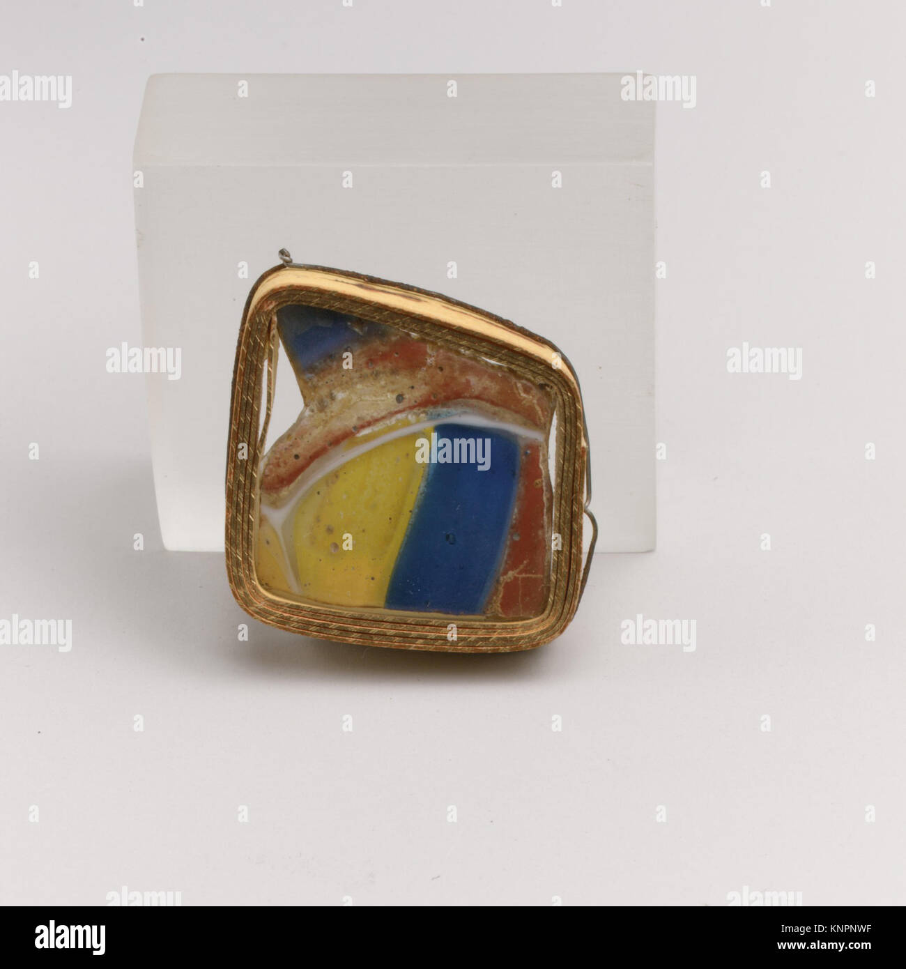 This short-strip glass mosaic bowl fragment displays linear colored ...