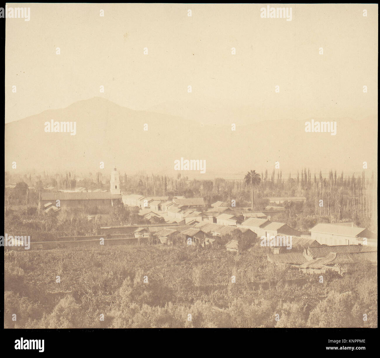 A landscape depicting a town on a plain with a mountain in the ...