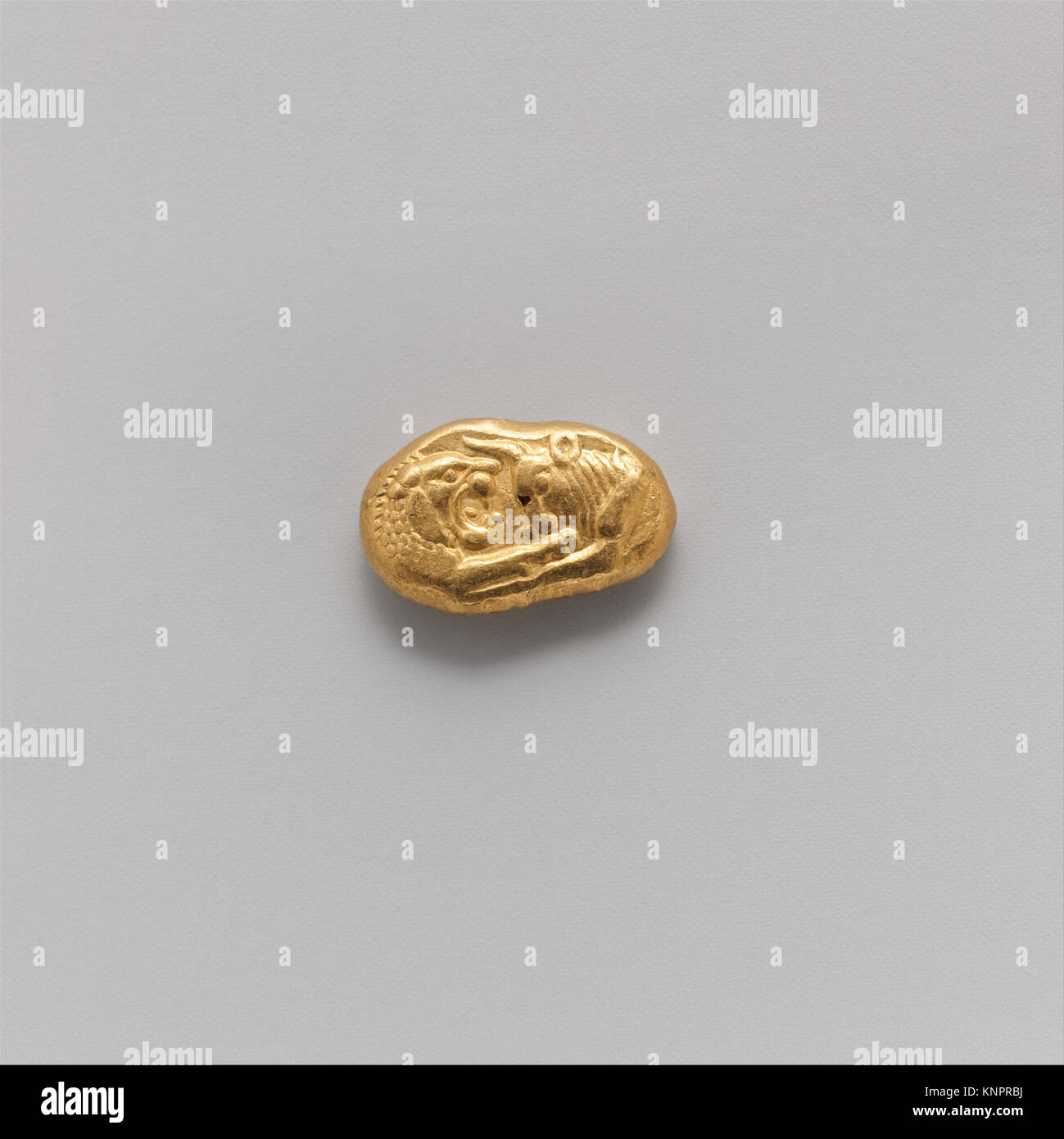 A Lydian gold stater coin from circa 560–546 B.C., small in size, used ...