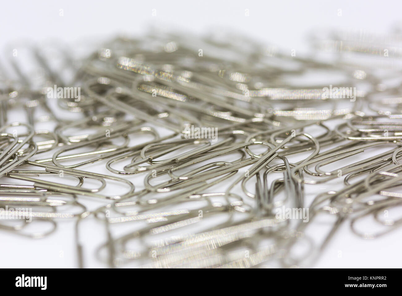 Scattered Paperclips on a white background with selective blur Stock ...