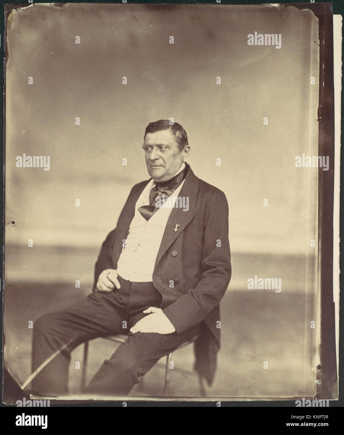 Seated man in dark clothing hi-res stock photography and images - Alamy