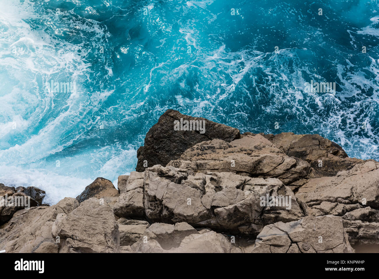Rocky Cliff Contrast From Above with Crashing Blue Water Whitecaps ...