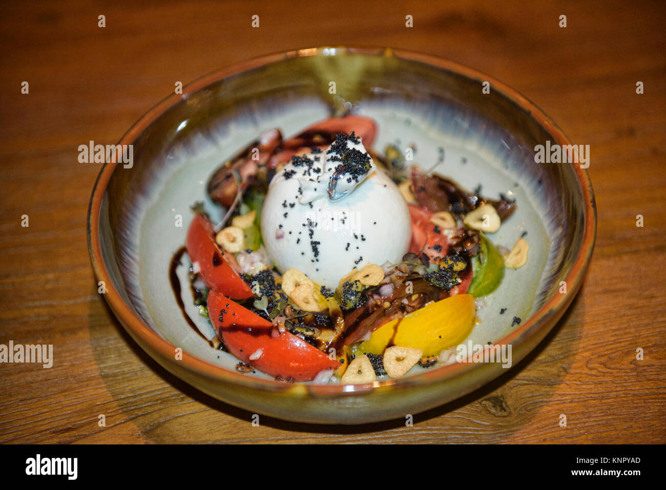 Burrata cheese plate at a restaurant in Bangkok, Thailand Stock Photo ...