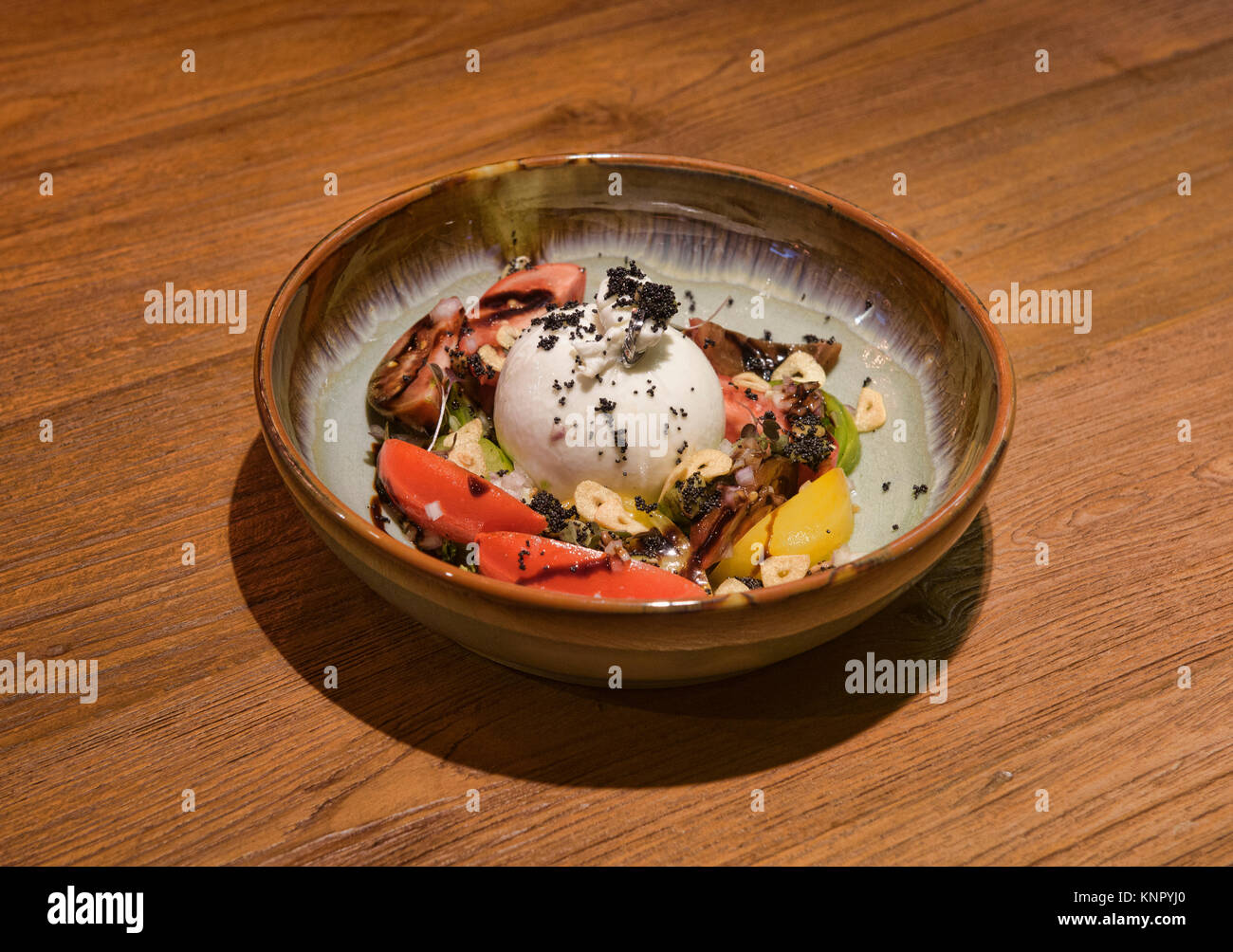Burrata cheese plate at a restaurant in Bangkok, Thailand Stock Photo ...