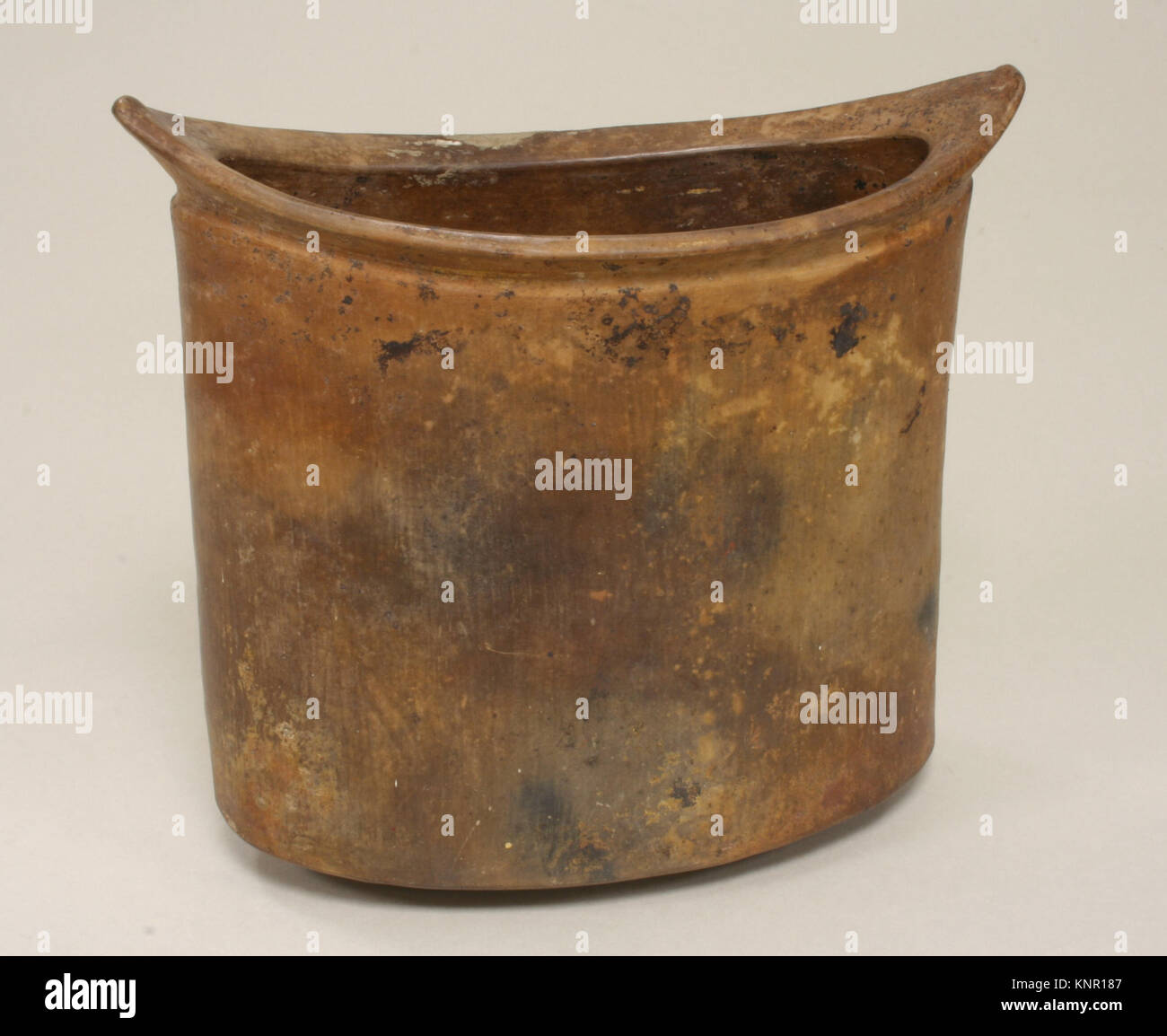 Ceramic vessel showing shape, design, and surface details, representing ...