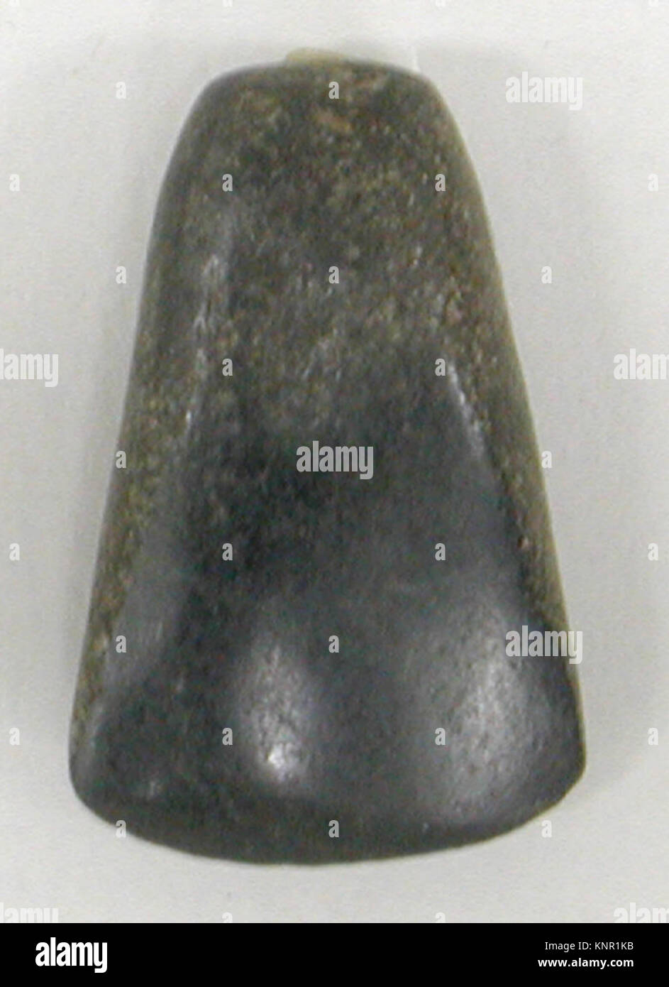 This celt is a prehistoric stone tool used for cutting or carving ...