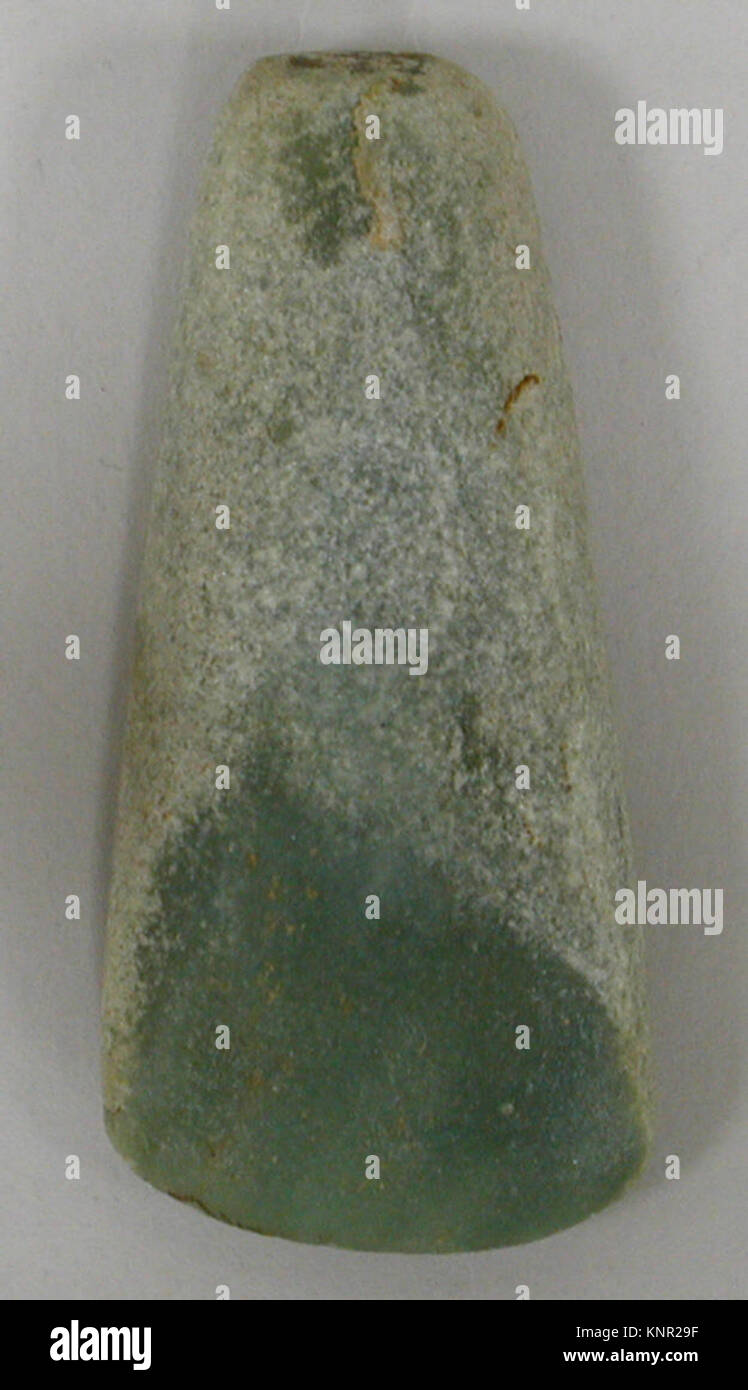 This greenstone axe head, known as a 'celt,' is a significant artifact ...