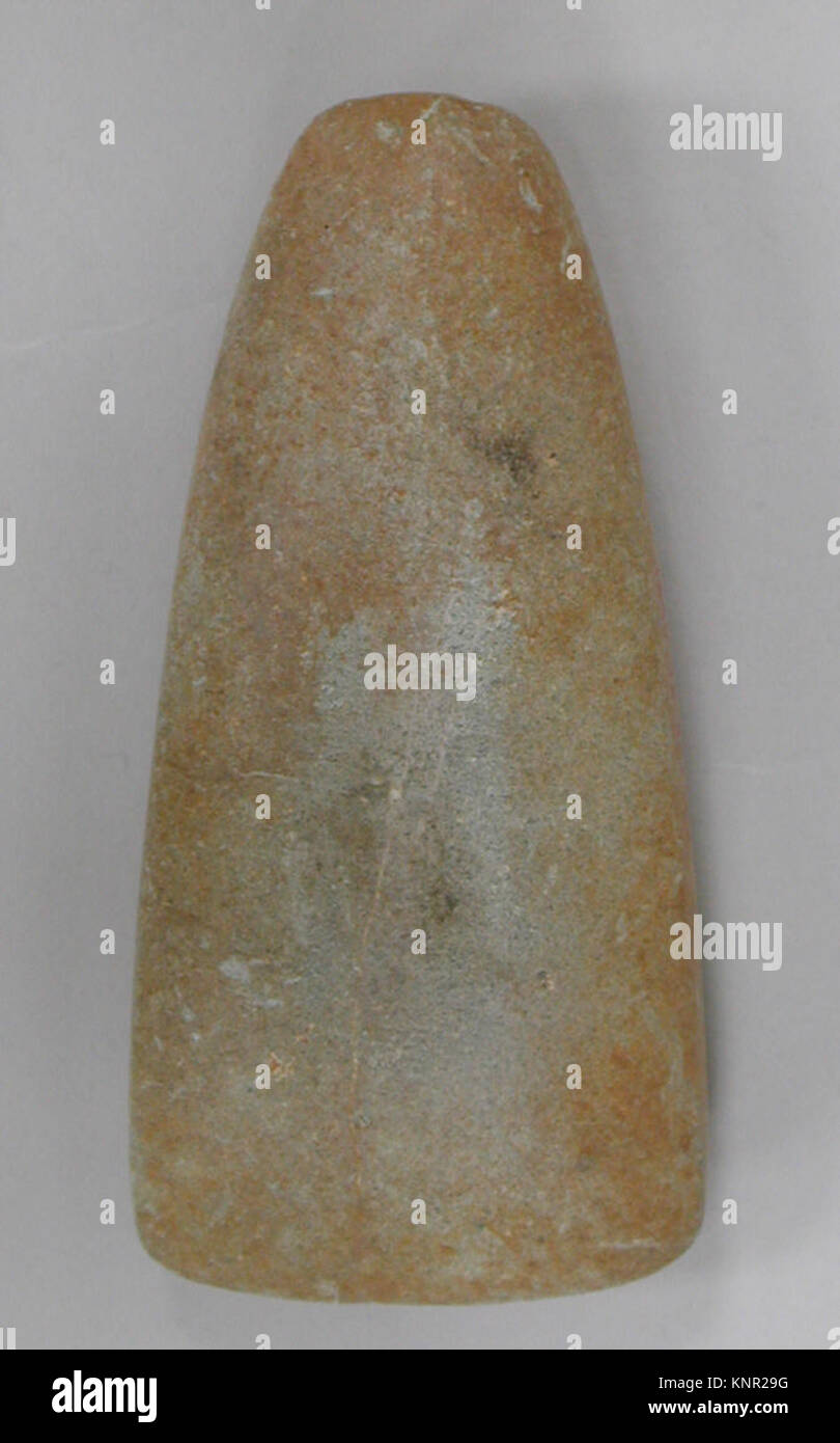 This greenstone axe head, known as a 'celt,' is a significant artifact ...
