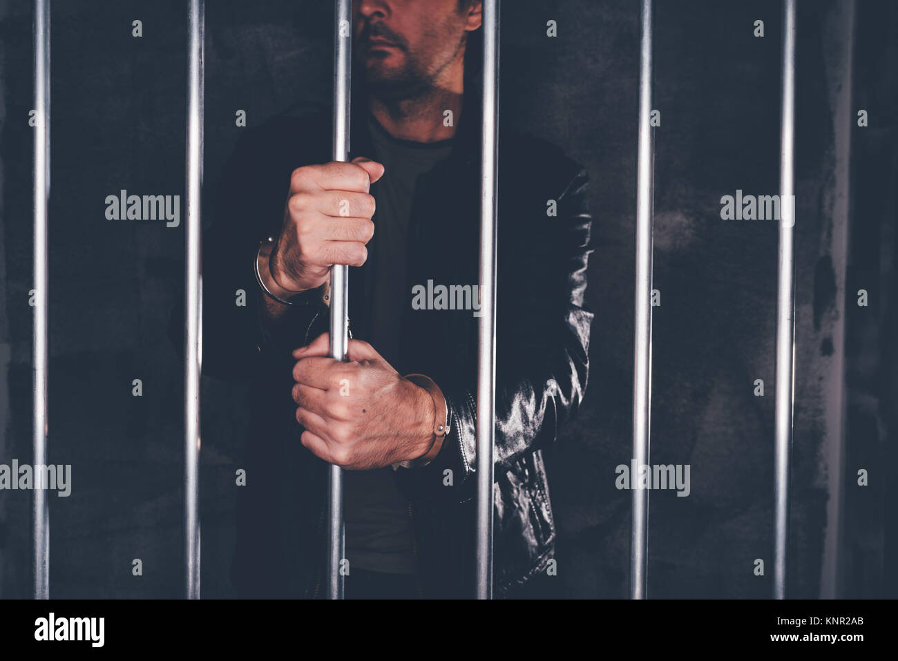 Man behind bars hi-res stock photography and images - Alamy