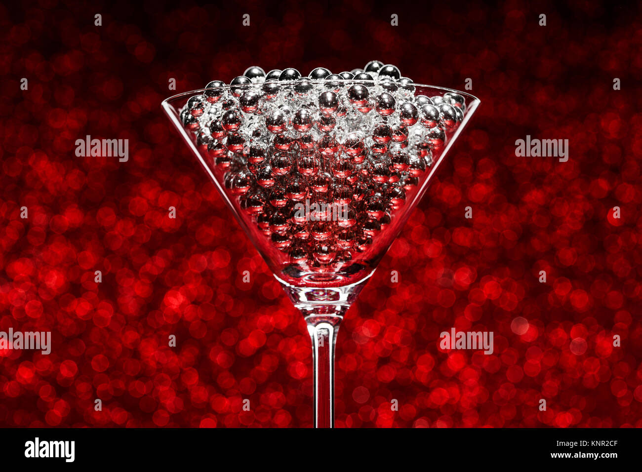 christmas glass on red glitter background. studio shot Stock Photo - Alamy