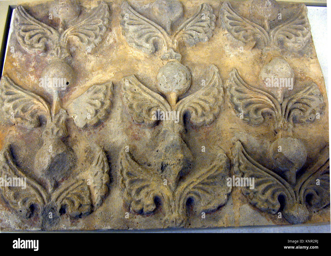 Stucco frieze showing decorative motifs and relief work, illustrating ...
