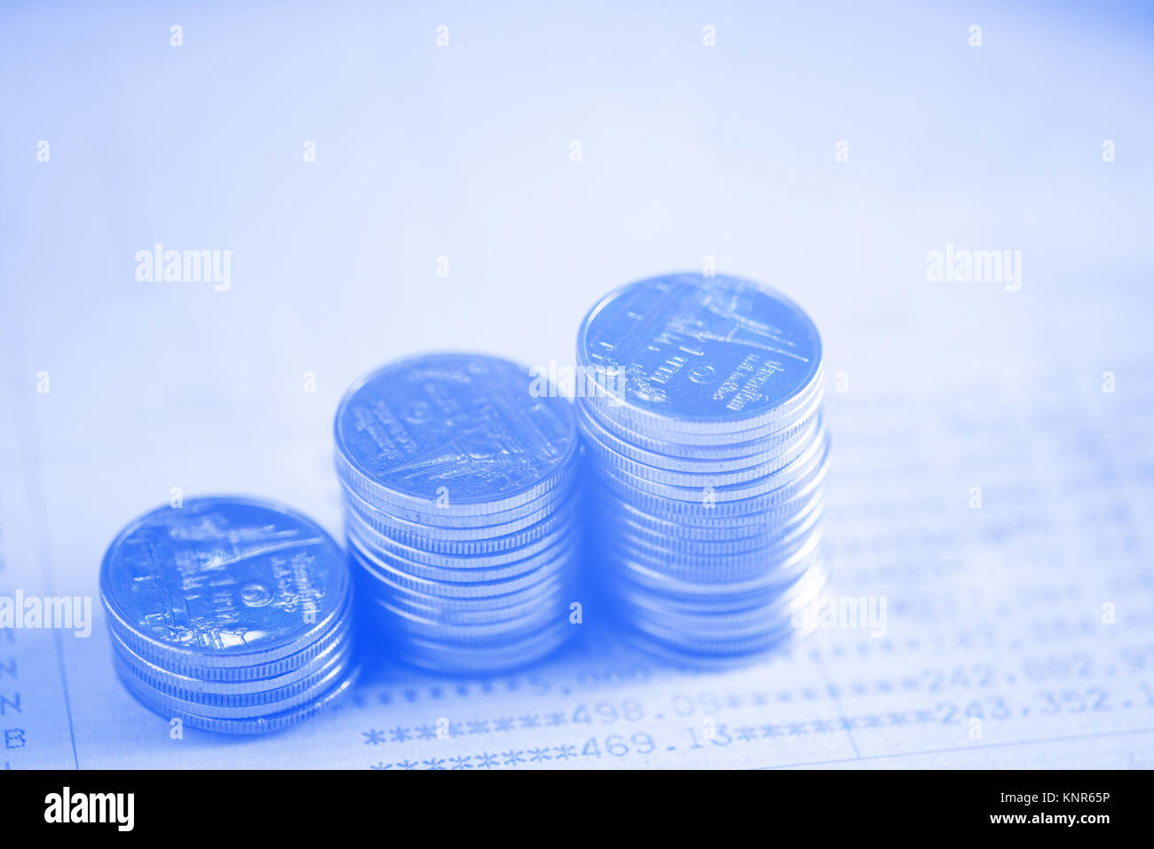 Stacks of coins and account book or credit card with copy space ...