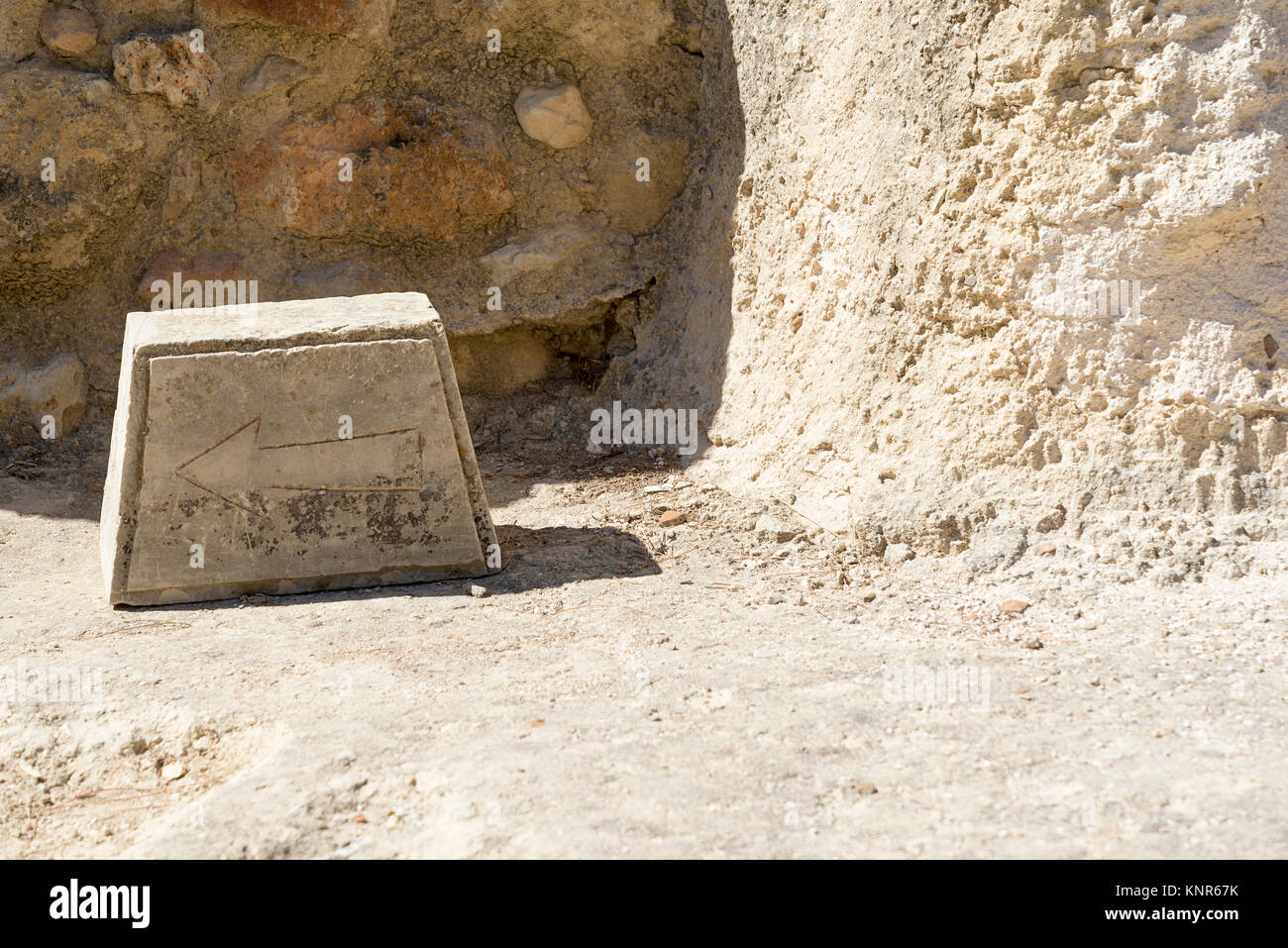 the arrow on the stone as a pointer. The arrow embossed on the stone ...