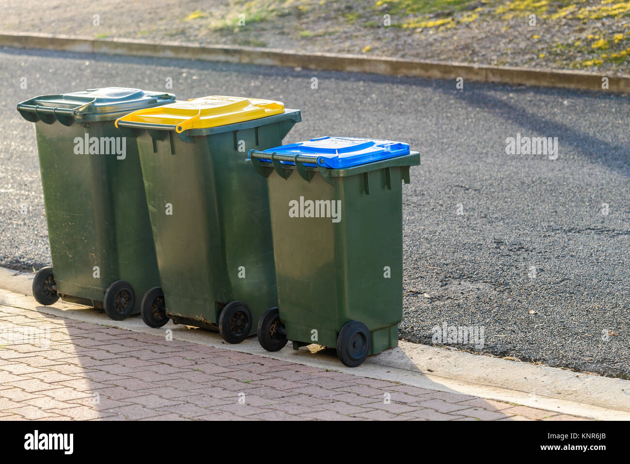 Kerbside waste bins ready for collection by local council in Australian ...