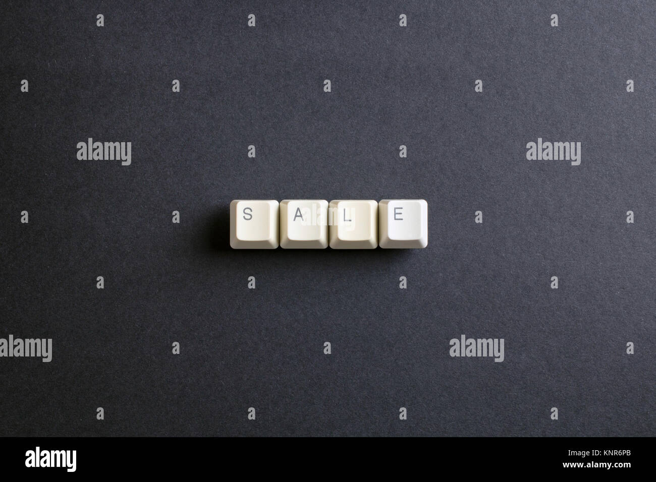 Sale word concept. Flat lay view from above on the table with computer keyboard keys buttons on ...