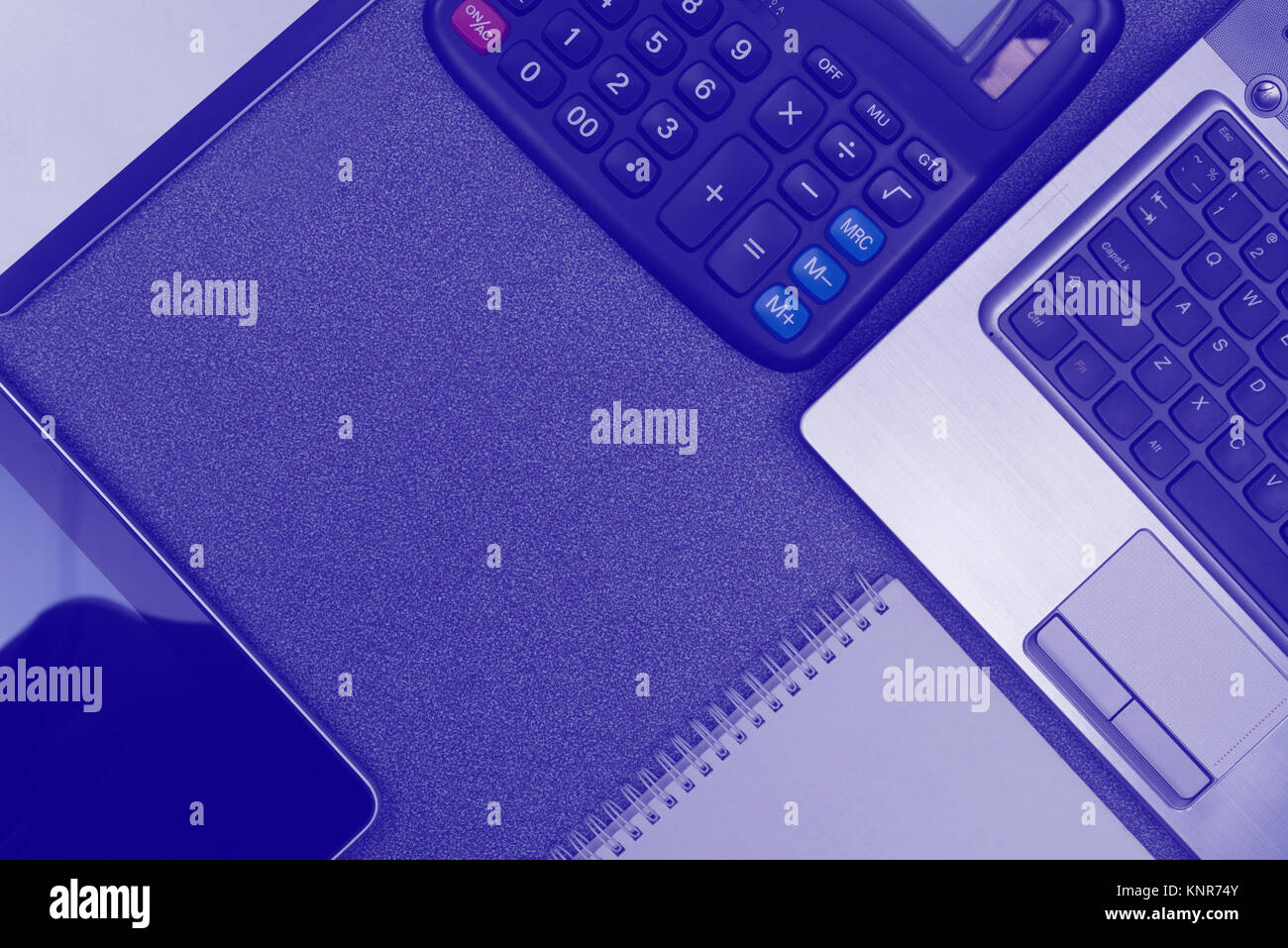 Laptop computer or notebook and other device, calculator and notepad on ...